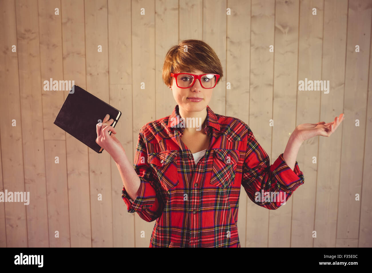 Confused pretty young woman posing Stock Photo - Alamy