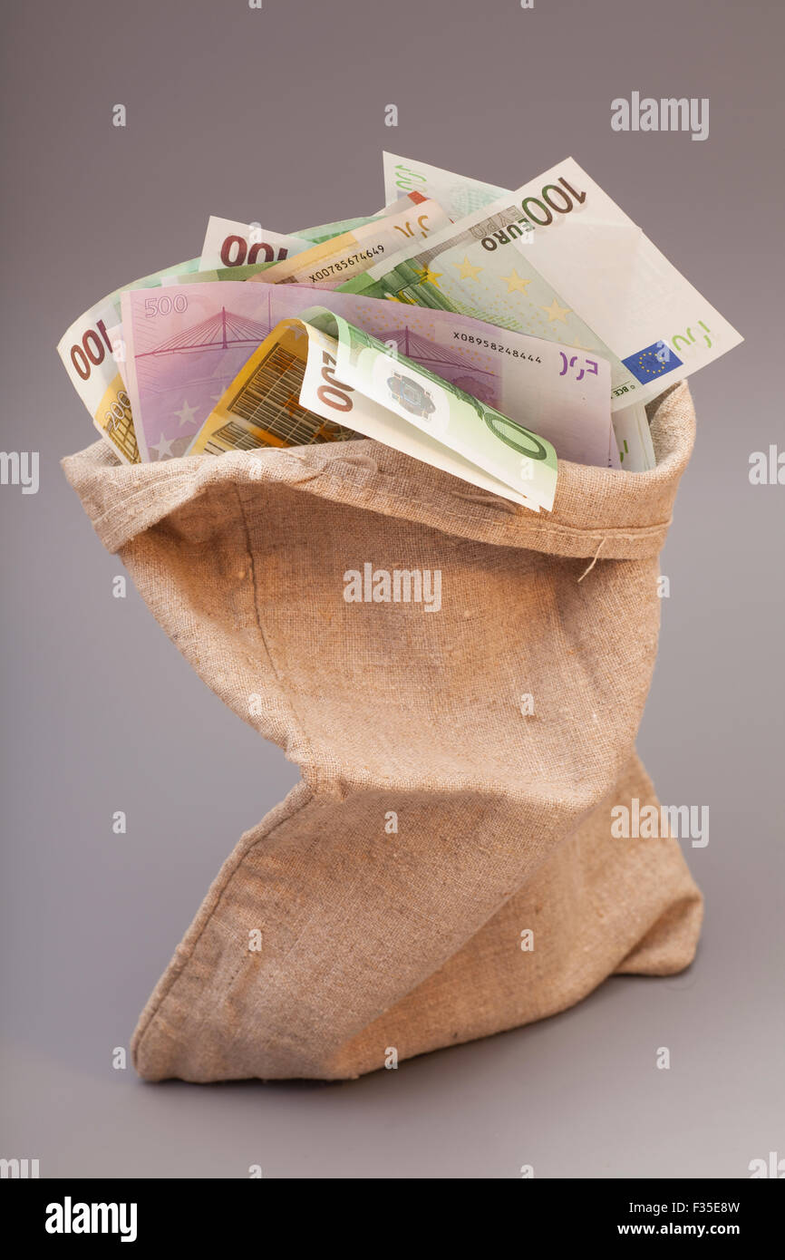 Money bag with euro isolated on gray background Stock Photo - Alamy