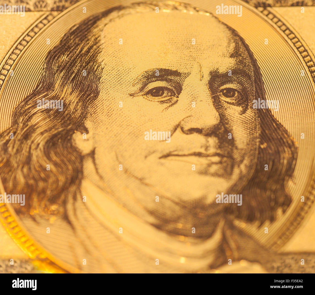 Golden Portrait of Benjamin Franklin on a one hundred dollar banknote ...