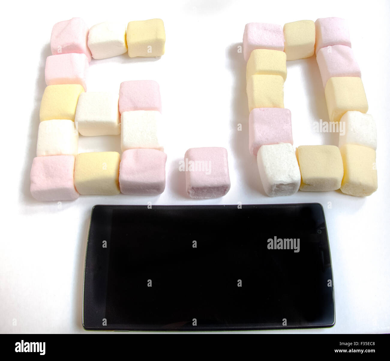Mobile phone with colored marshmallows candies Stock Photo - Alamy
