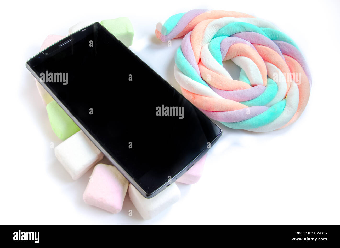 Mobile phone with colored marshmallows candies Stock Photo - Alamy