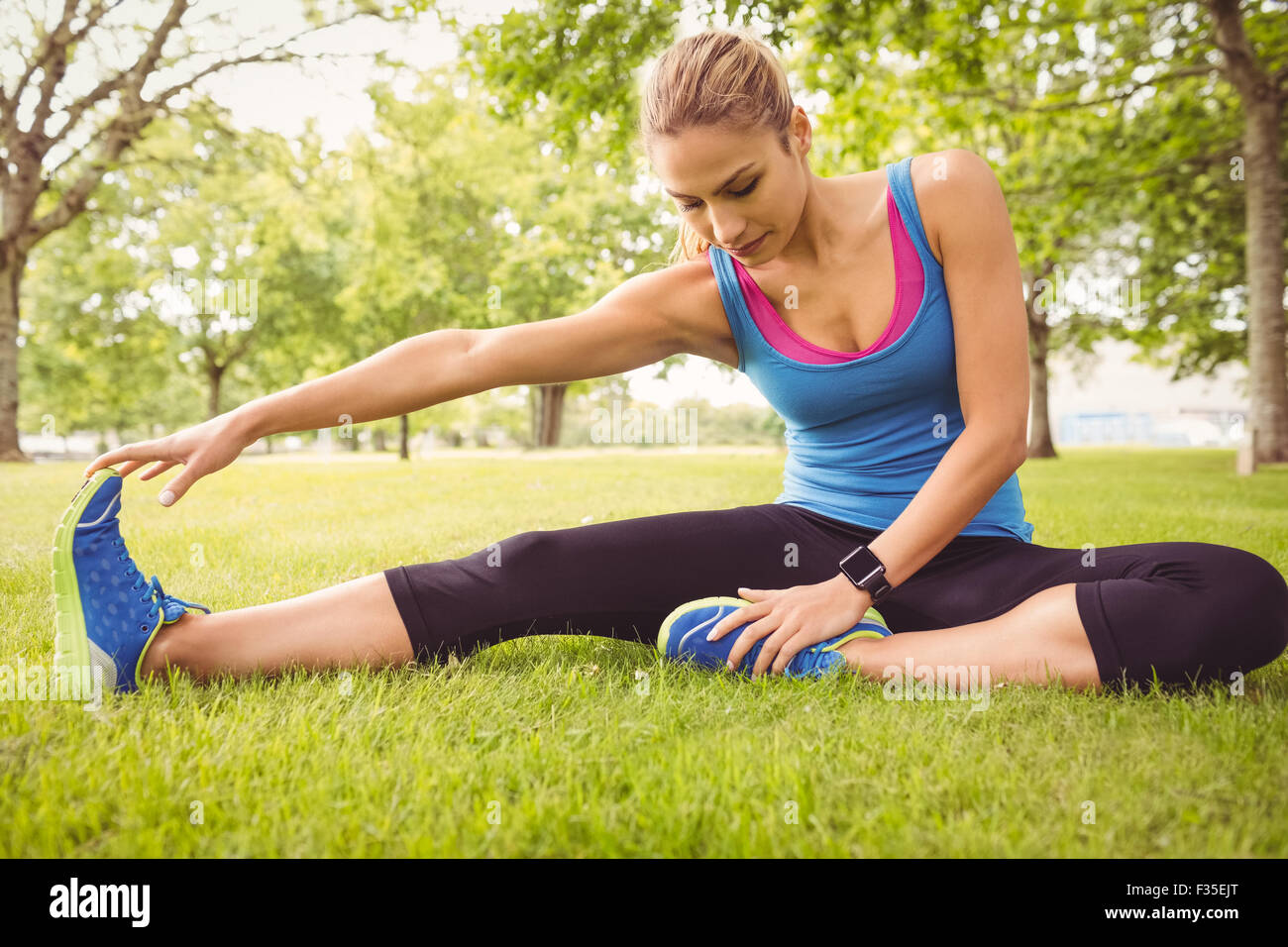 Sporty woman stretching leg Stock Photo - Alamy