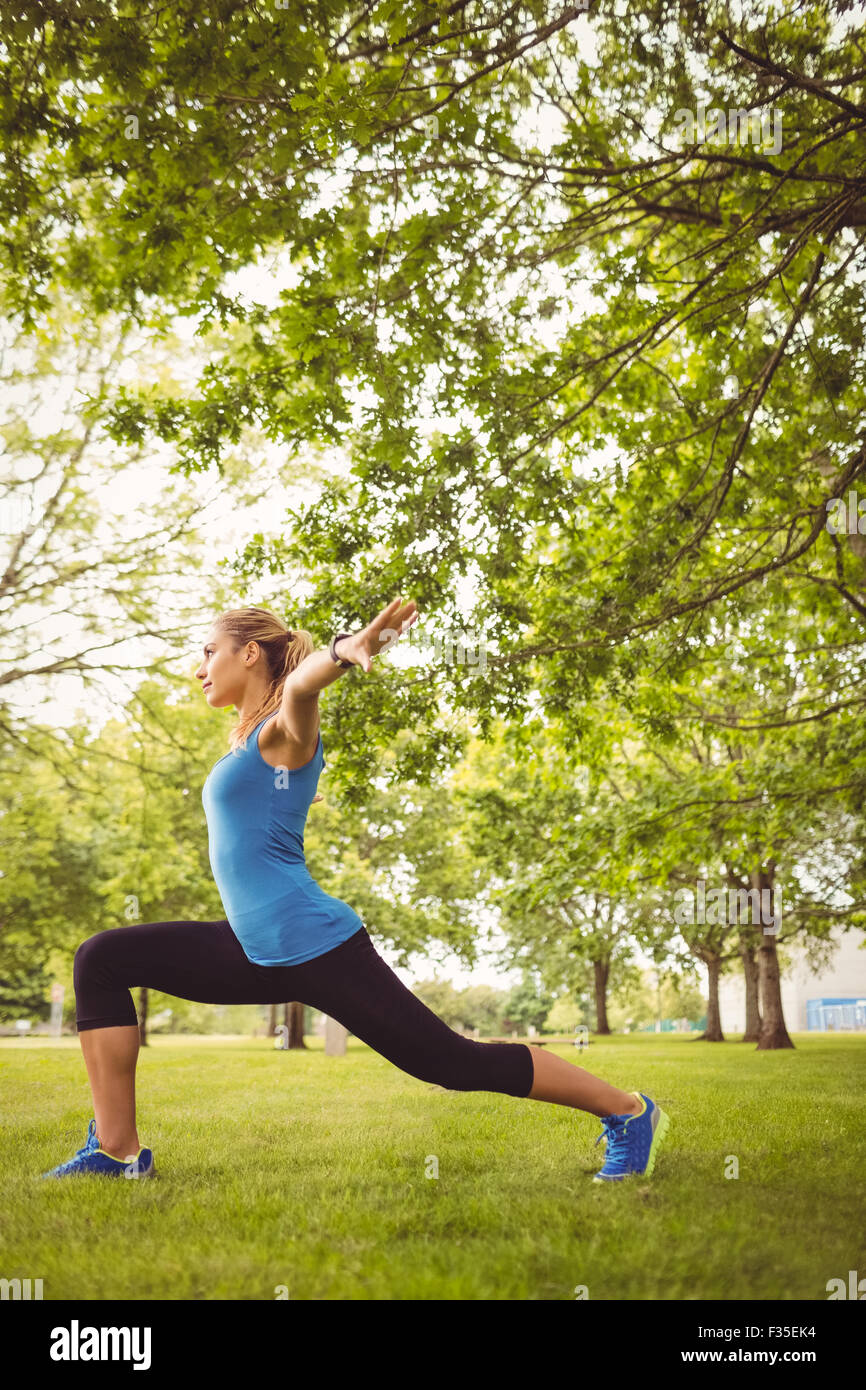 Side view of woman doing stretching exercise Stock Photo - Alamy
