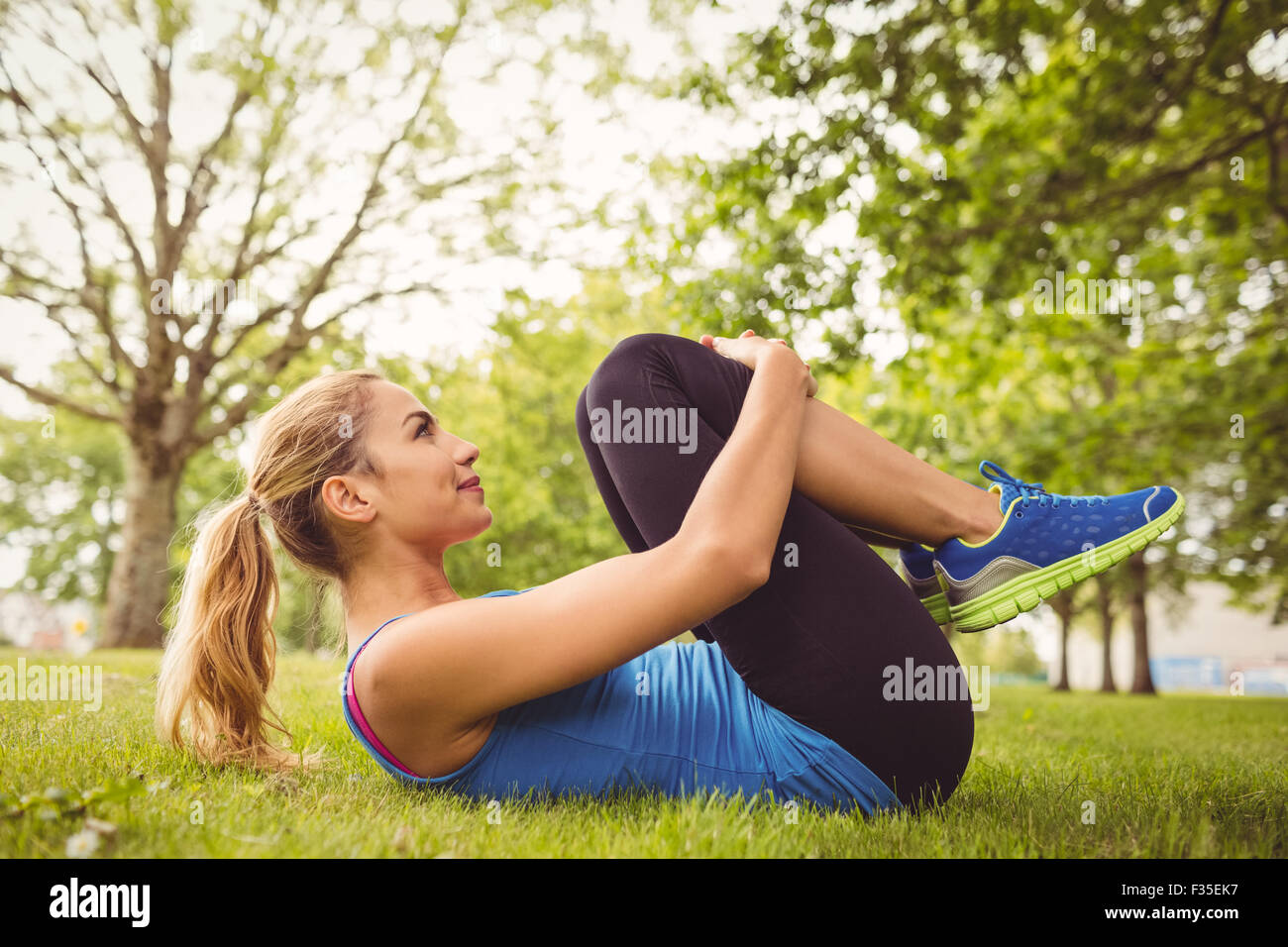Woman crossed legs stretching hi-res stock photography and images - Alamy