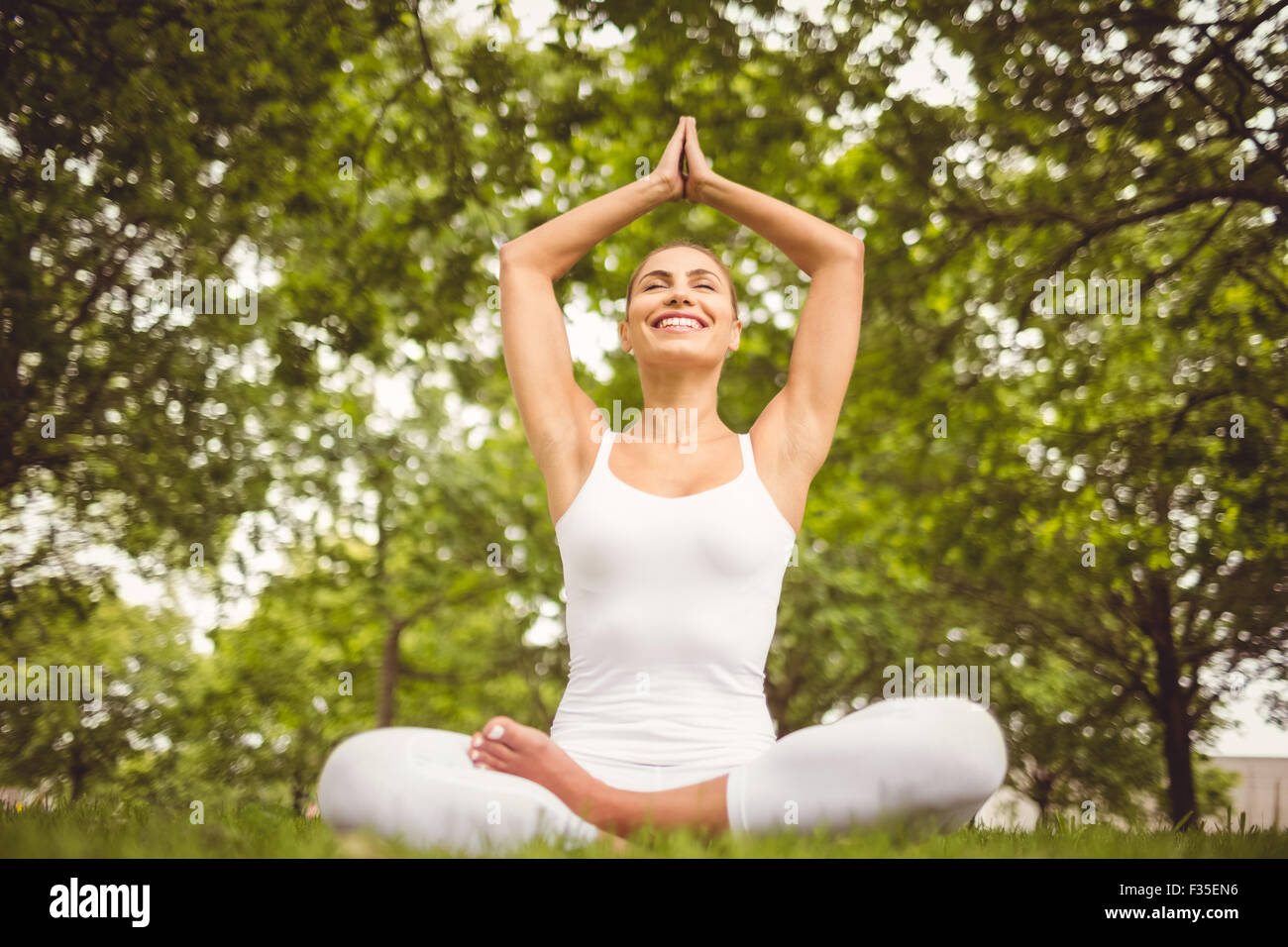 Low angle view of smiling woman with eyes closed Stock Photo - Alamy