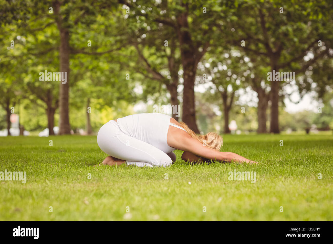 Full length woman stretching body Stock Photo - Alamy