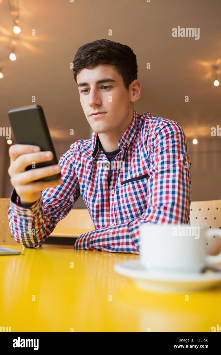 Low angle view of young man using mobile phone Stock Photo - Alamy