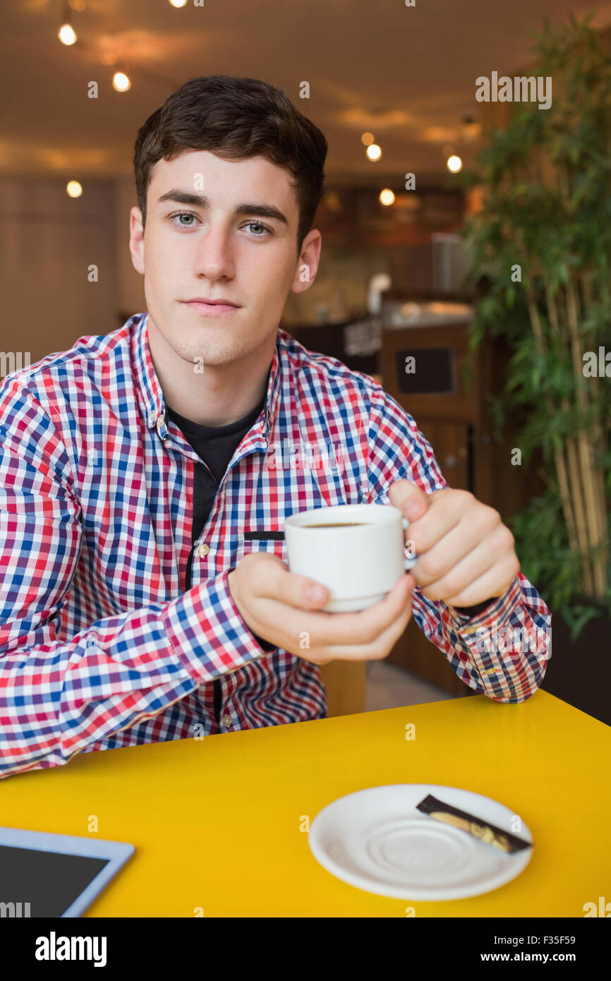 Young man with coffee cup hi-res stock photography and images - Alamy