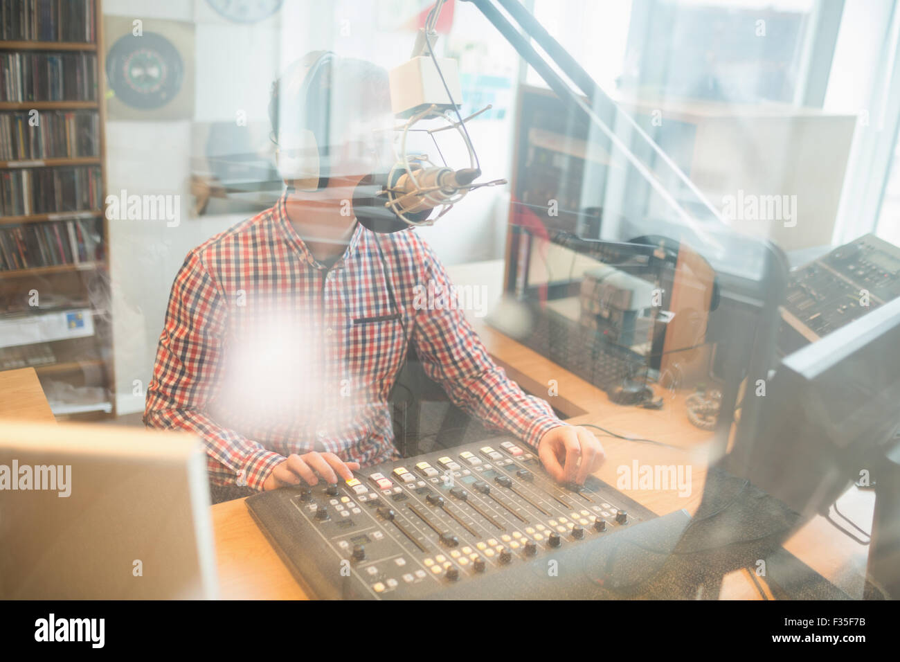 Radio host operating sound mixer hi-res stock photography and images ...