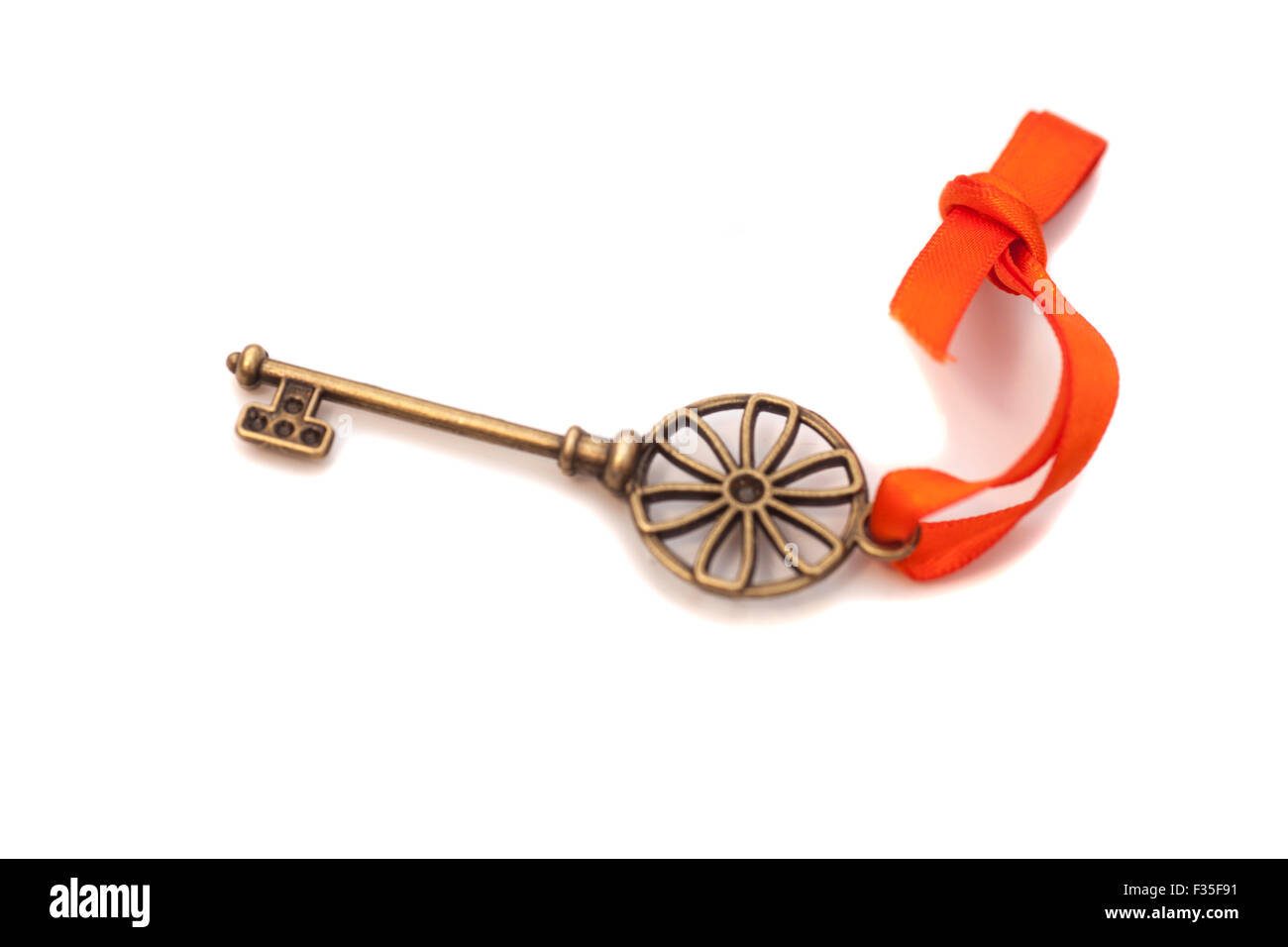 Key To Success With Red Bow isolated on white Stock Photo - Alamy