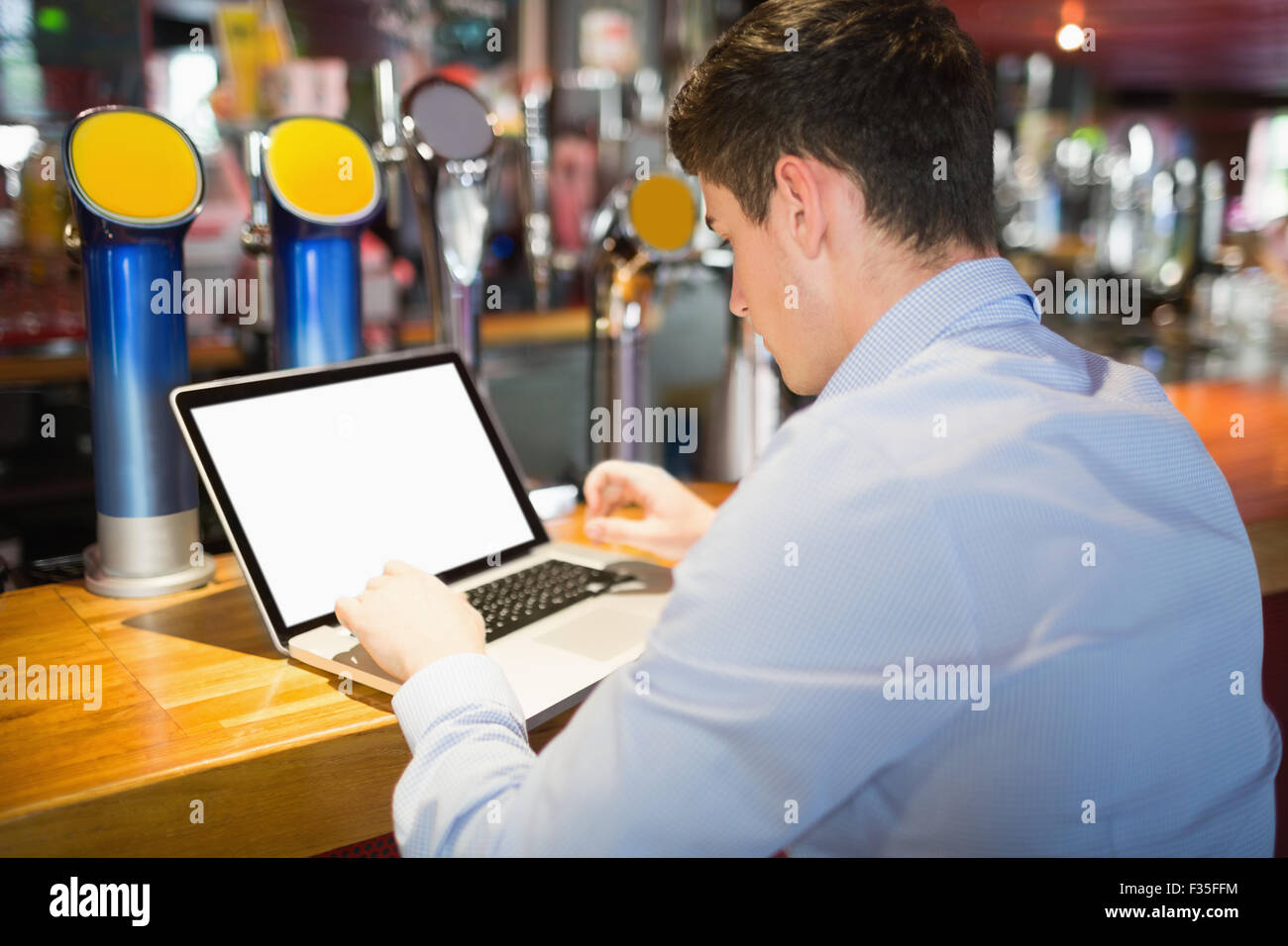 Working at bar hi-res stock photography and images - Alamy