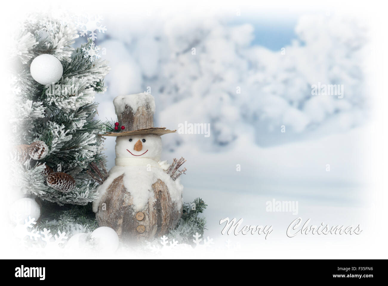 Merry Christmas greeting card with snowman next to tree Stock Photo - Alamy