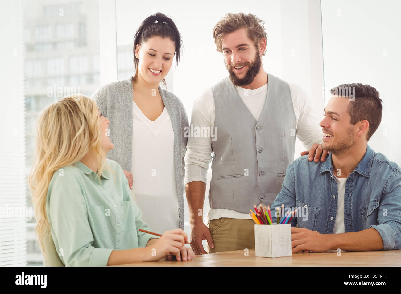 Smiling business people talking Stock Photo - Alamy