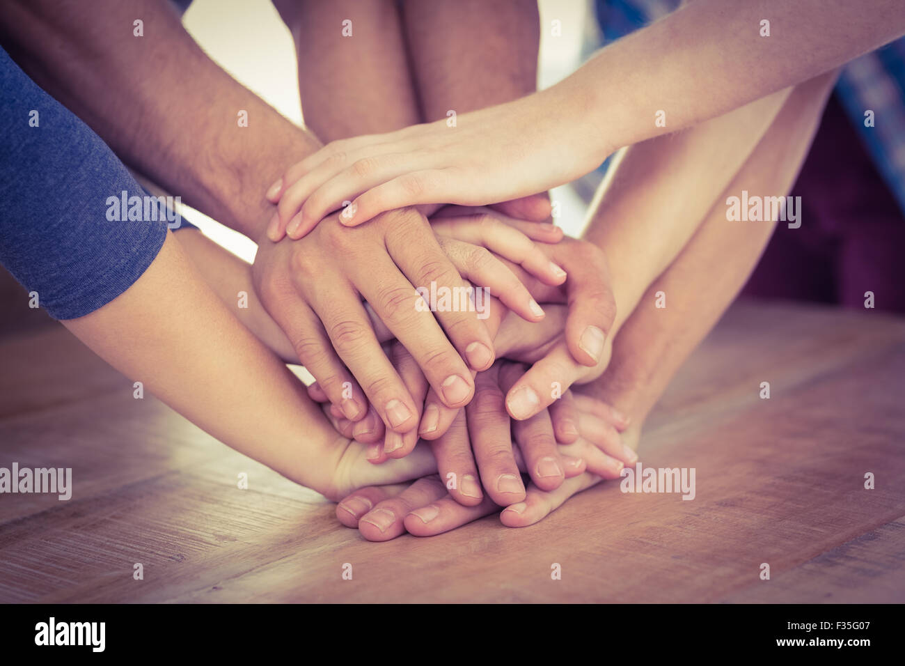 Business team putting their hands together Stock Photo - Alamy