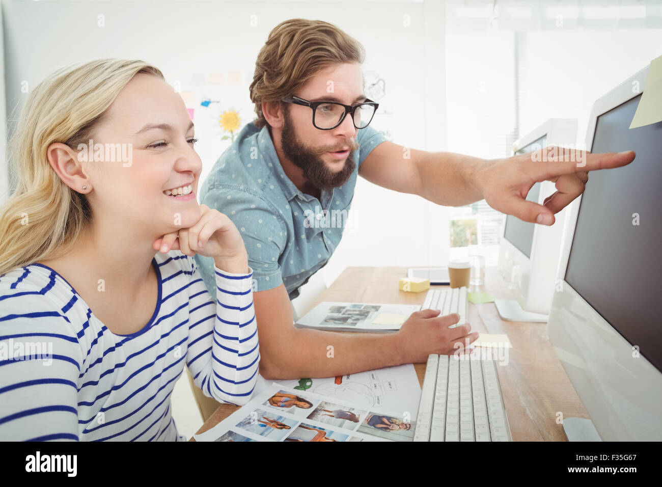 Man pointing at computer Stock Photo - Alamy
