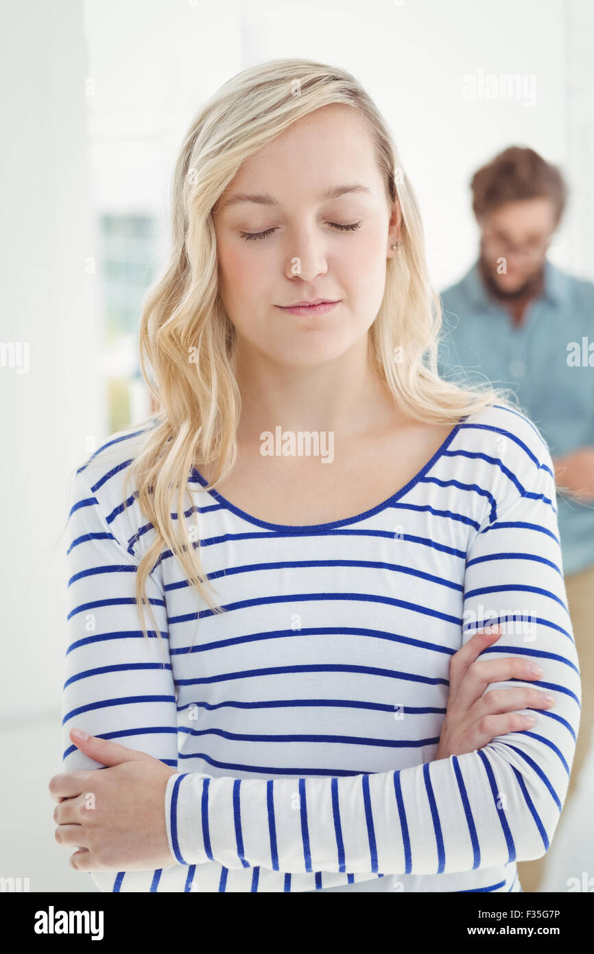 Woman with eyes closed and arms crossed Stock Photo - Alamy