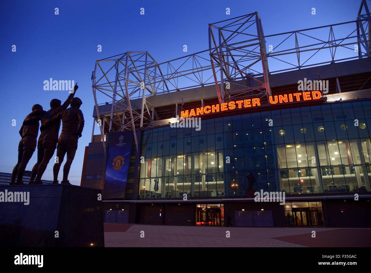 The Old Trafford in Manchester with the United Trinity Sculpture (L ...