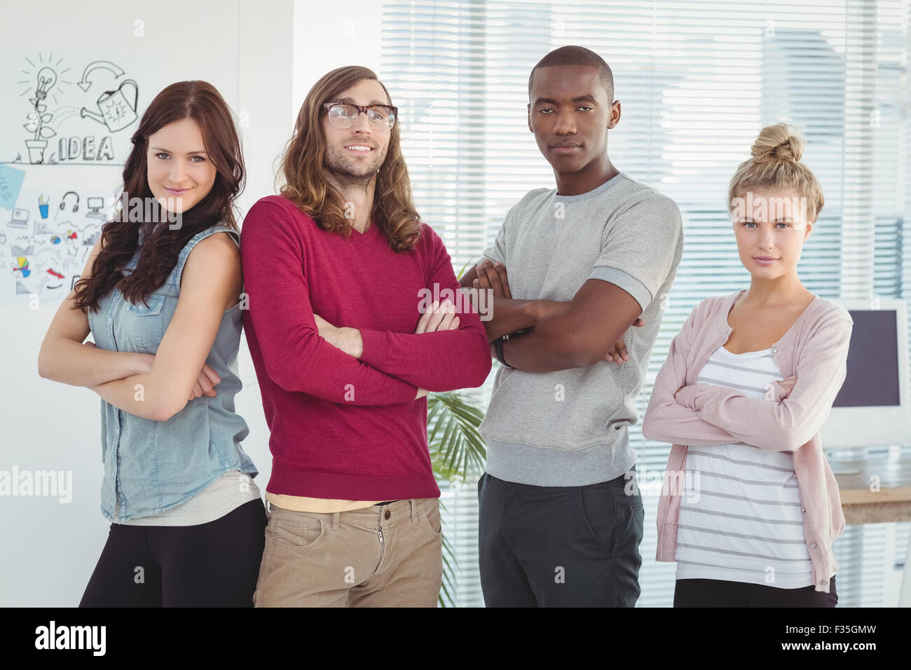 Portrait of business team with arms crossed Stock Photo - Alamy