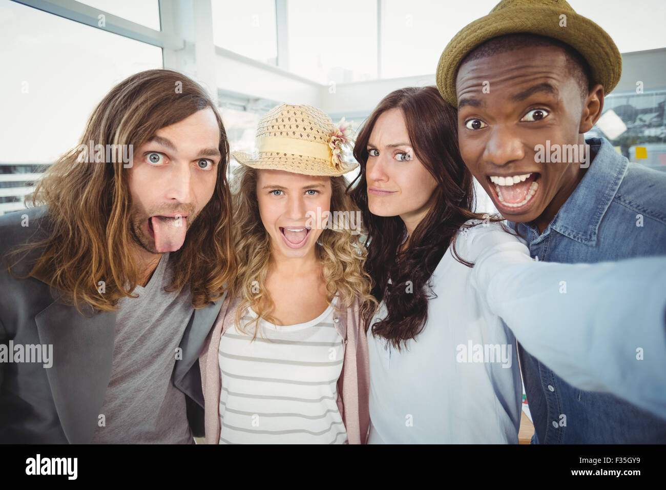 Business team making face while taking self portrait Stock Photo - Alamy