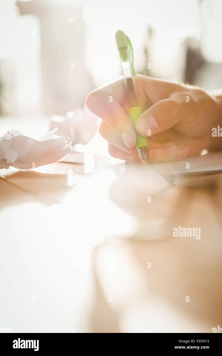 Cropped hand writing on paper Stock Photo - Alamy