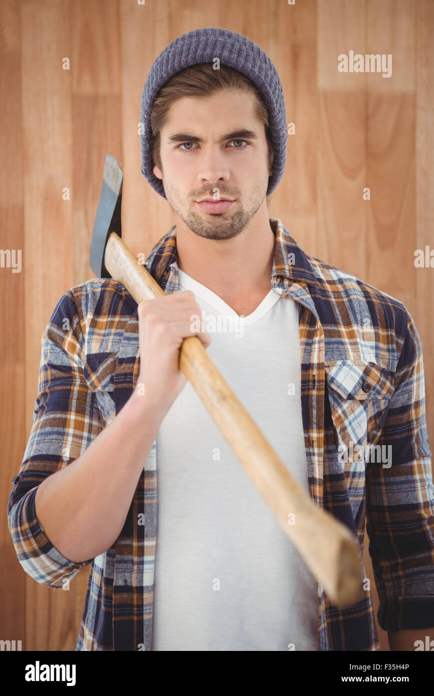 Portrait of hipster holding axe on shoulder Stock Photo - Alamy