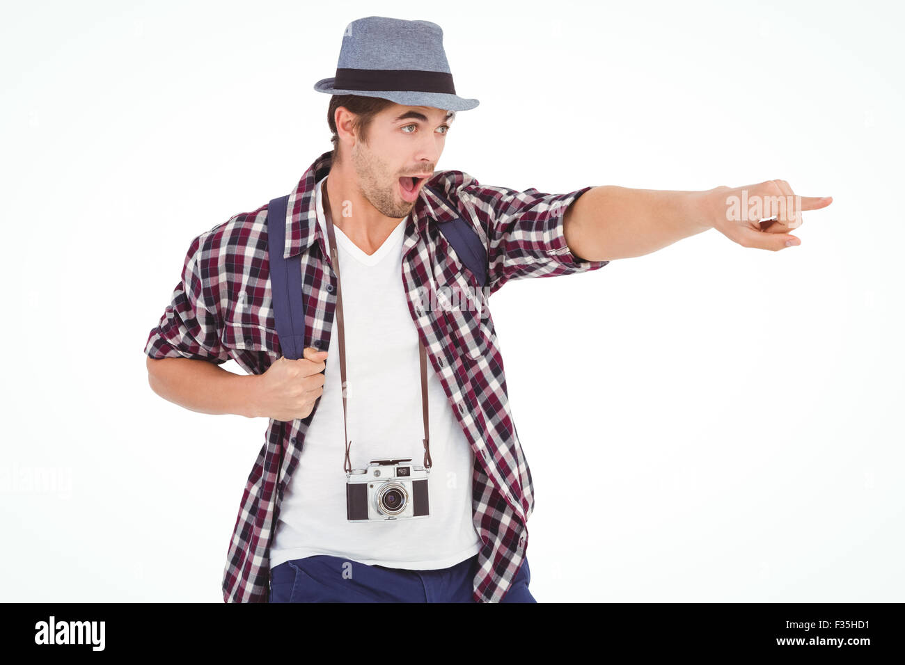 Surprised man with backpack pointing Stock Photo - Alamy