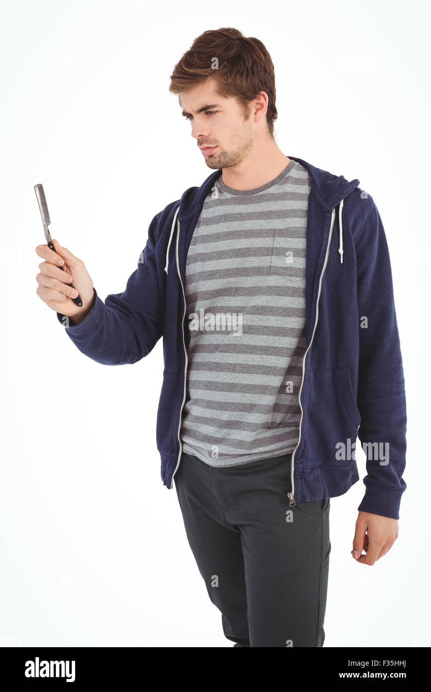 Man holding straight edge razor Stock Photo - Alamy