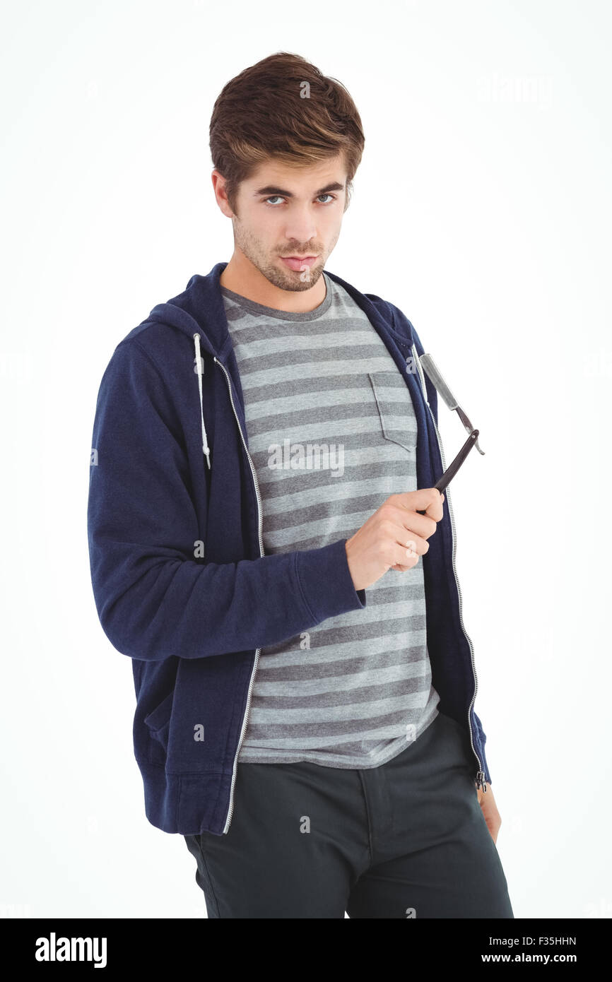 Portrait of confident man holding straight edge razor Stock Photo - Alamy