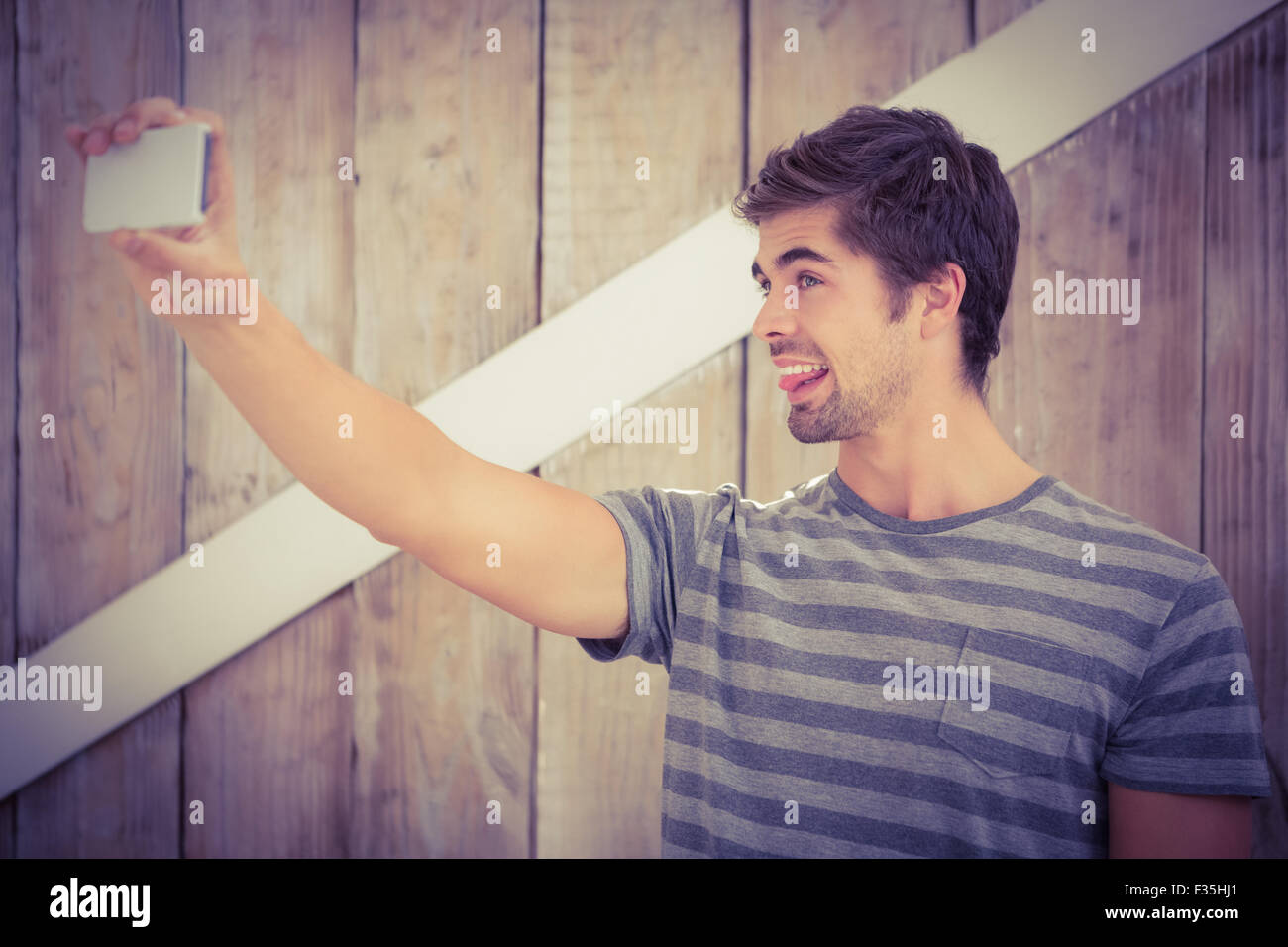 Happy man making face while taking selfie Stock Photo - Alamy