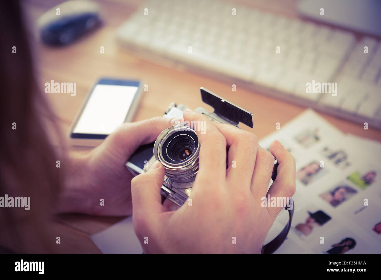 Cropped image of man adjusting camera lens Stock Photo - Alamy