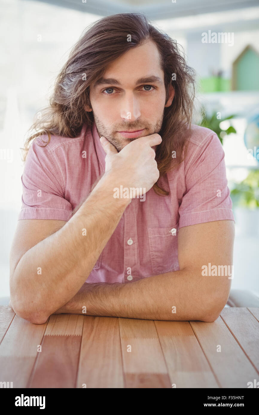 Smiling businessman with hand on hip Stock Photo - Alamy