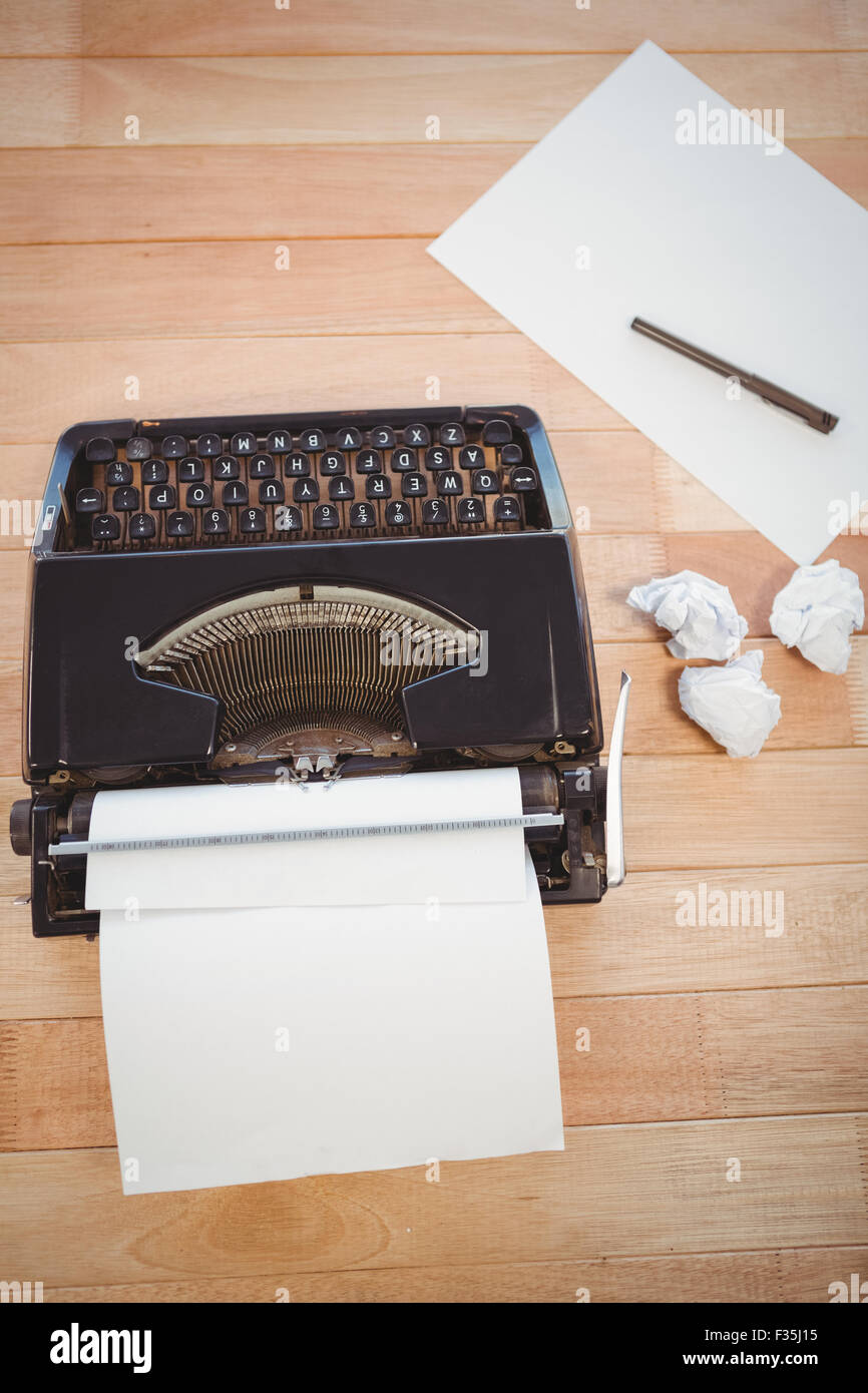 Typewriter and papers at desk in office Stock Photo - Alamy