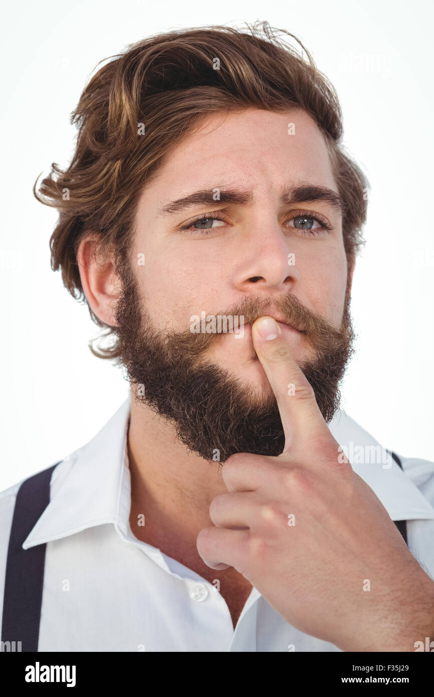 Portrait of hipster with finger on chin Stock Photo - Alamy