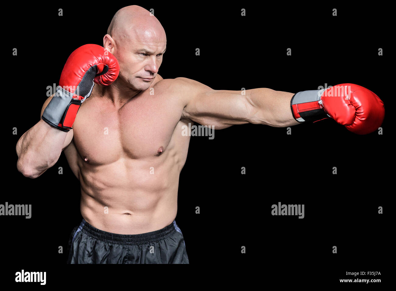 Bald boxer in fighting stance Stock Photo - Alamy