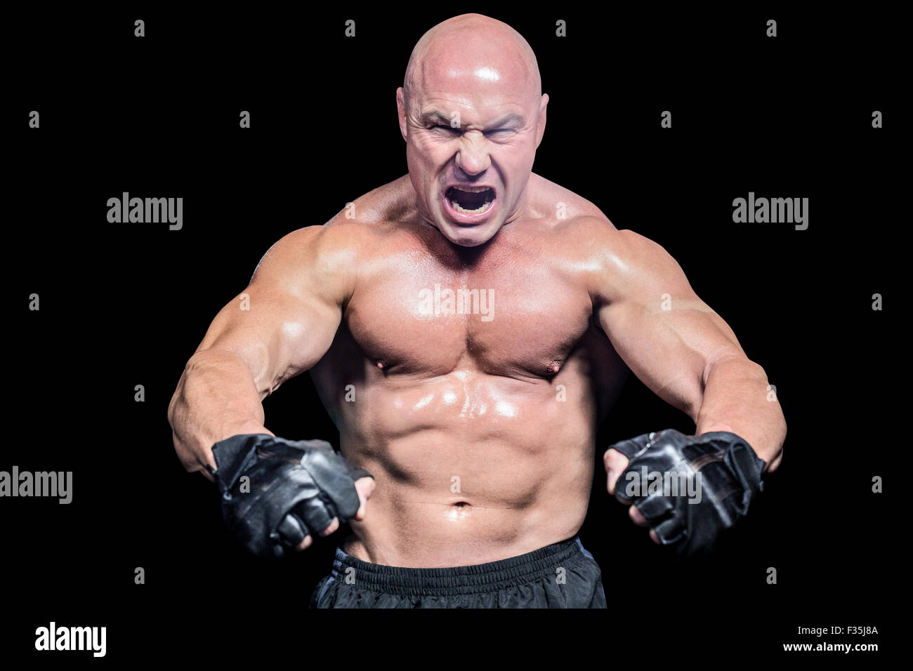 Aggressive fighter flexing muscles Stock Photo - Alamy