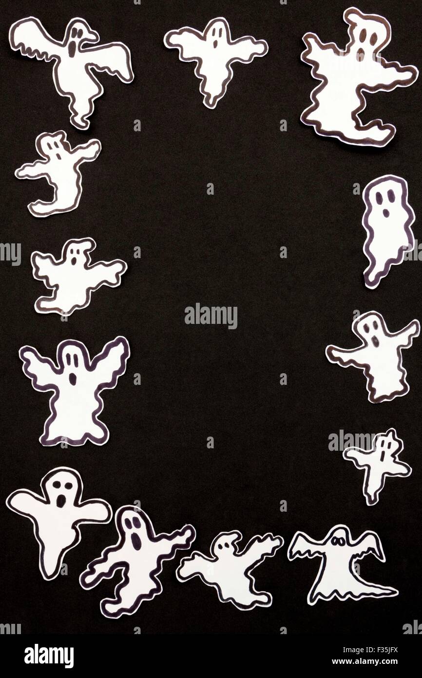 a vertical overhead view of a halloween frame made by ghosts Stock ...