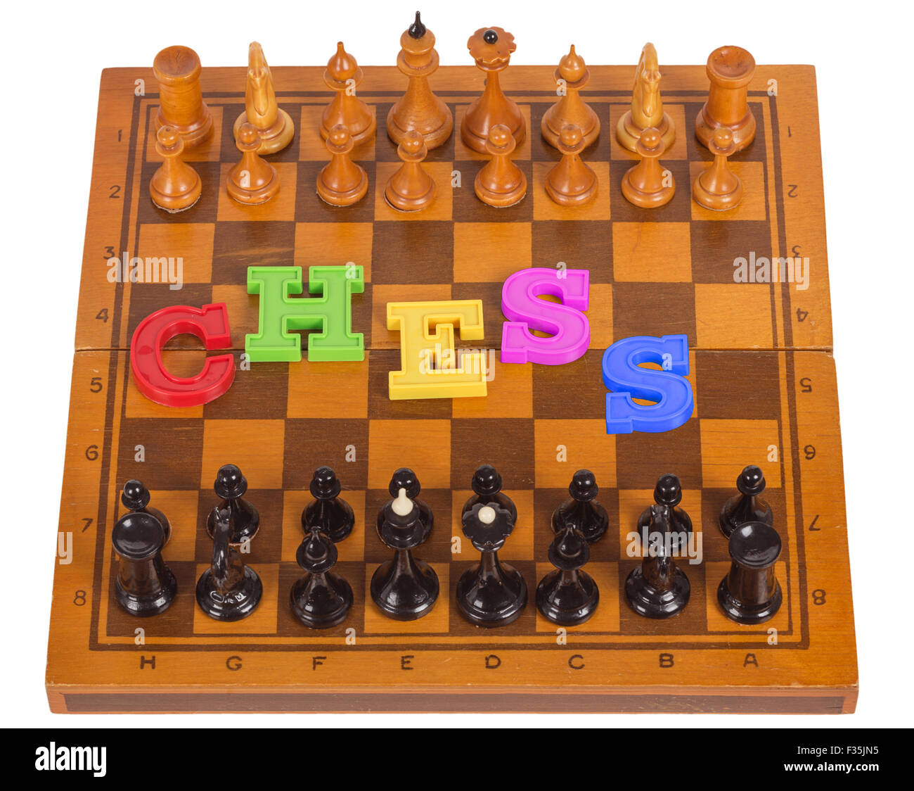 Chess board with figures with plastic letter isolated on white ...