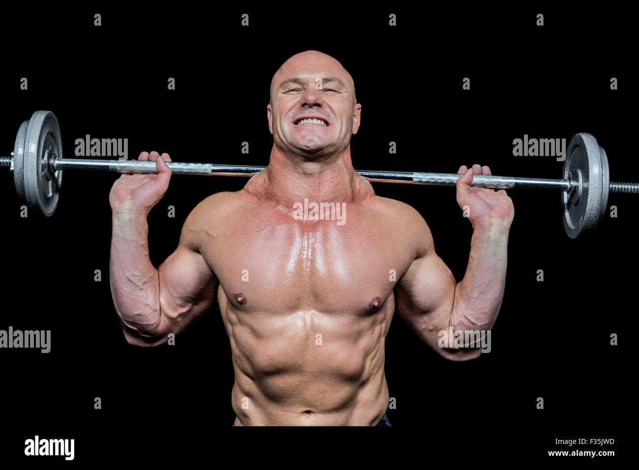 Confident muscular man lifting crossfit Stock Photo - Alamy