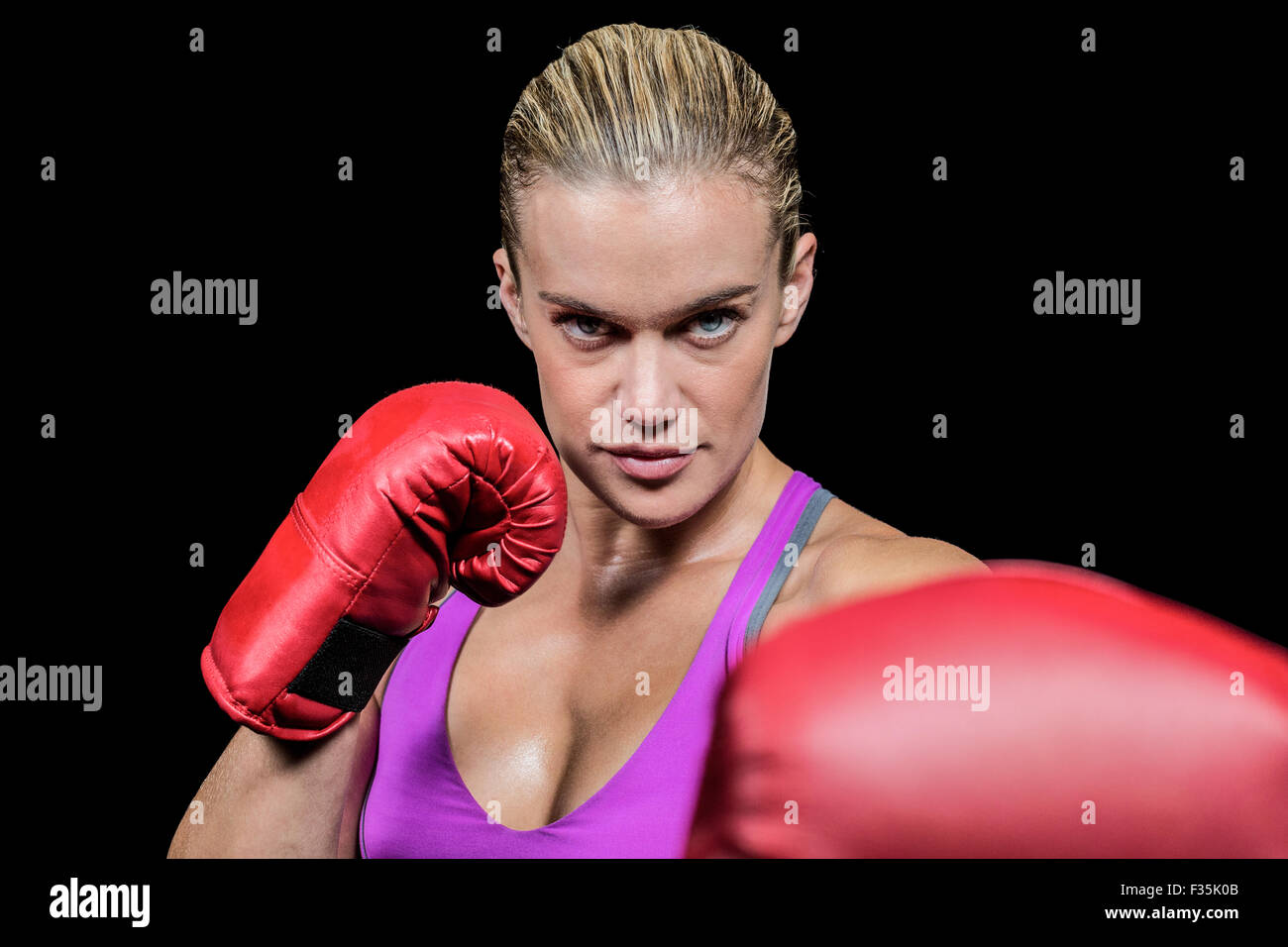 Portrait of female boxer with fighting stance Stock Photo - Alamy