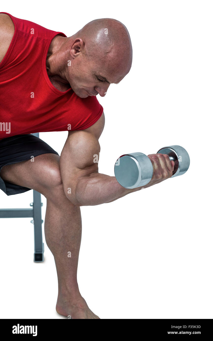 Bald man exercising by lifting dumbbells Stock Photo - Alamy