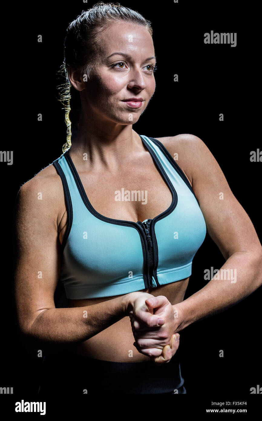 Fit woman stretching hands Stock Photo - Alamy