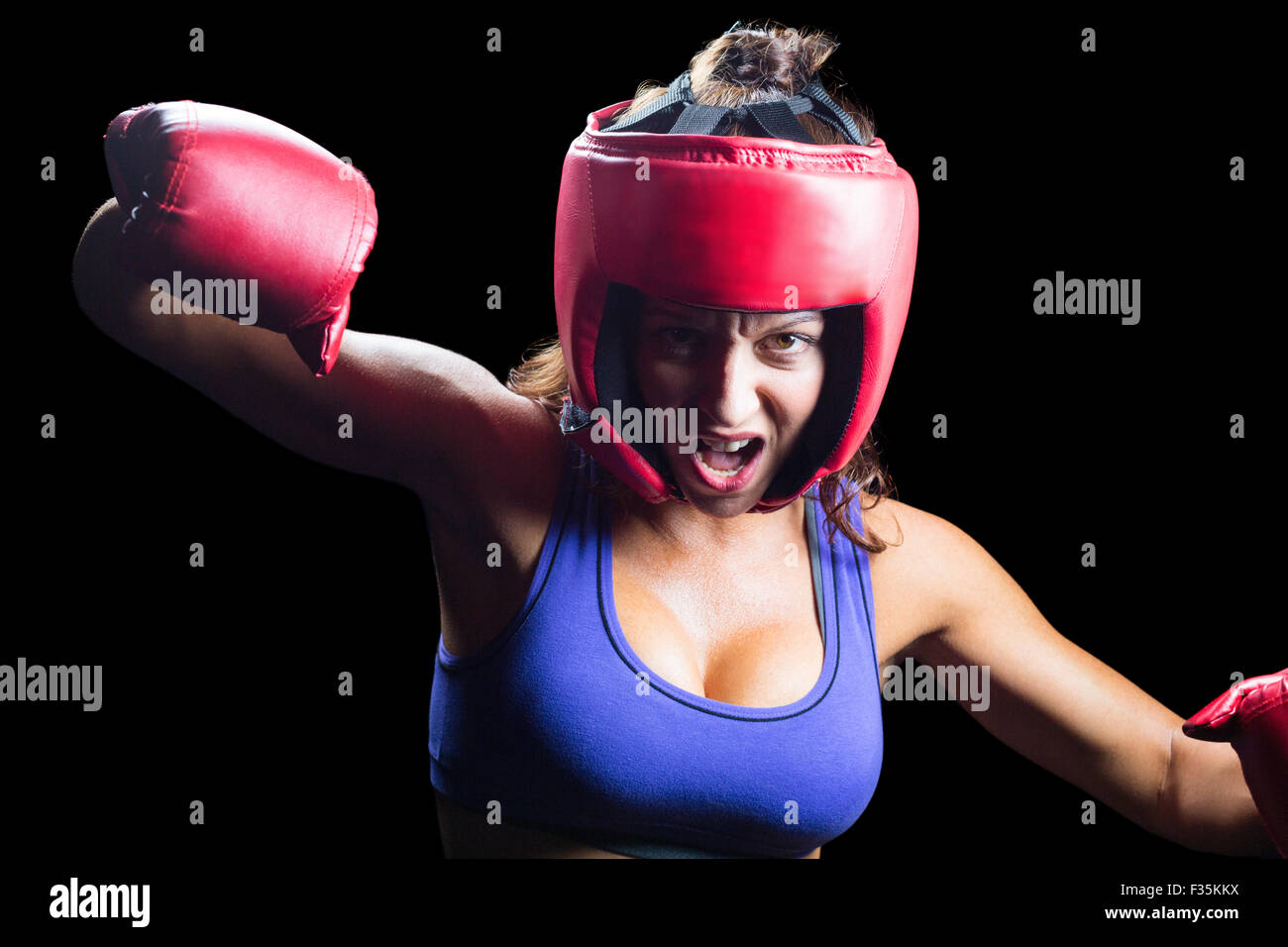 Portrait of angry female boxer with fighting stance Stock Photo - Alamy