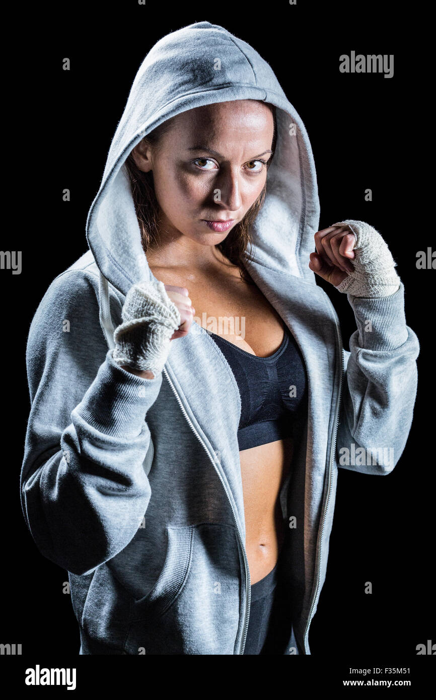 Portrait of female boxer in hood with fighting stance Stock Photo - Alamy