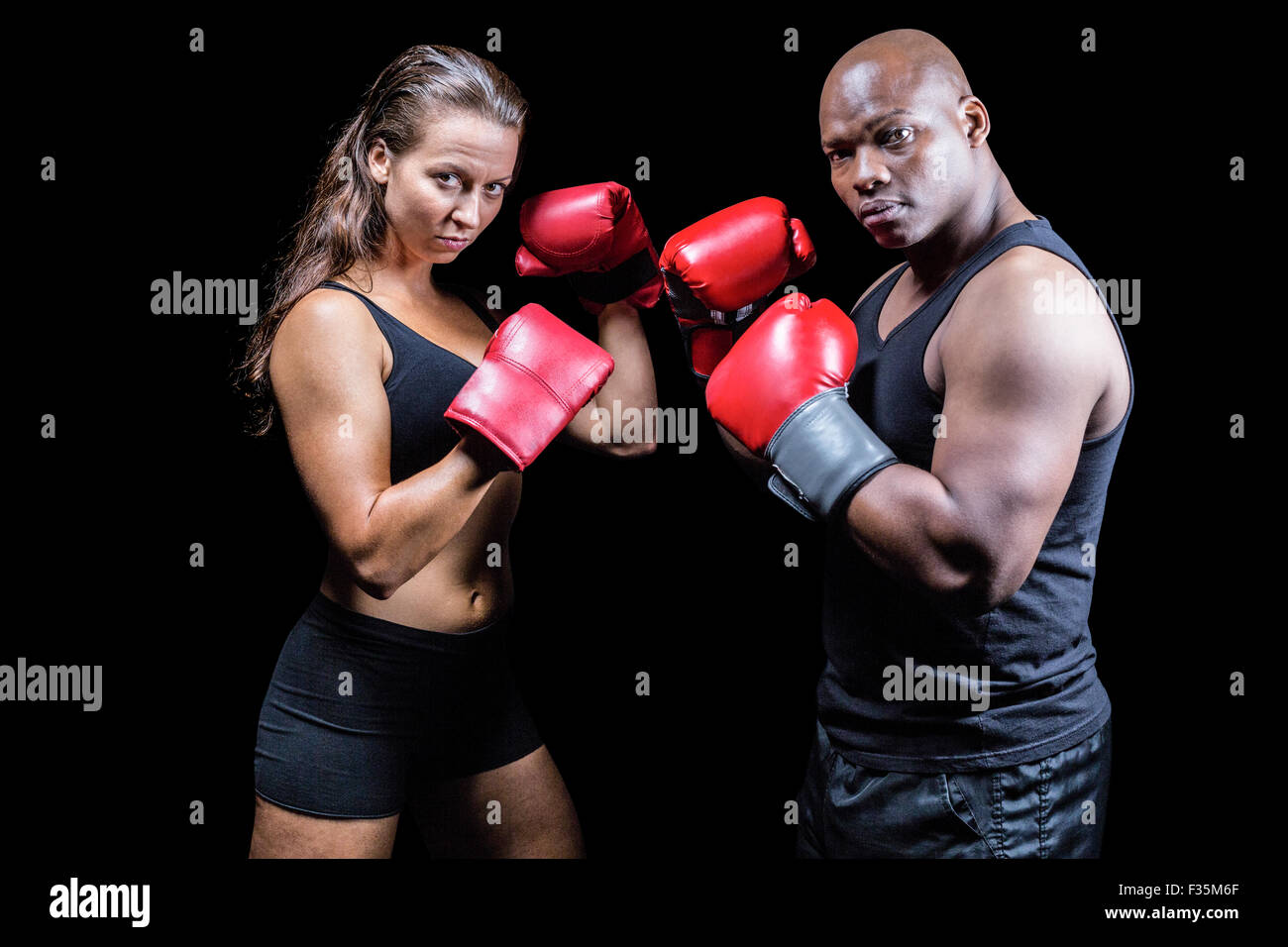 Portrait of male and female athletes with fighting stance Stock Photo ...