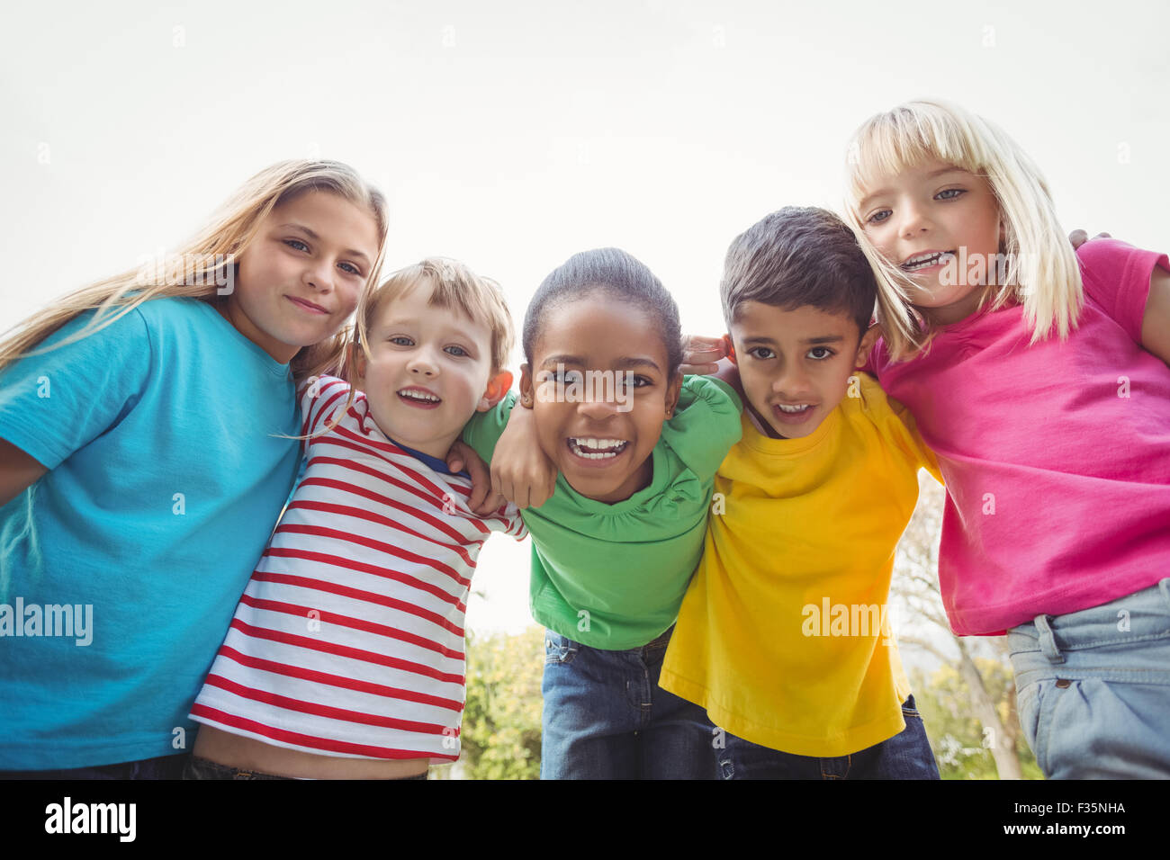 Smiling classmates with arms around each other Stock Photo - Alamy