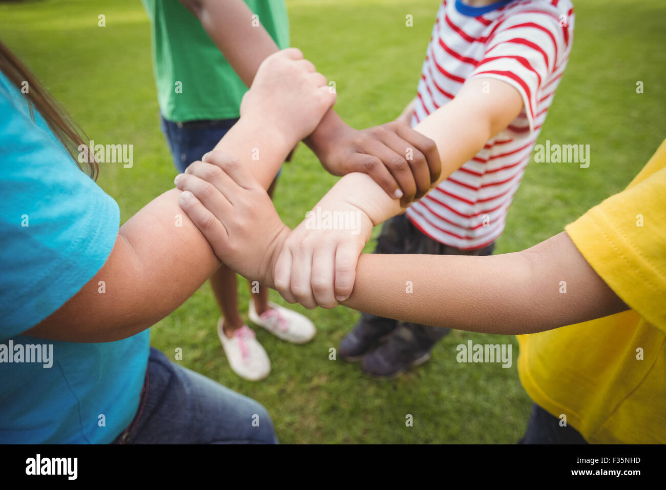 Diverse classmates holding arms Stock Photo - Alamy