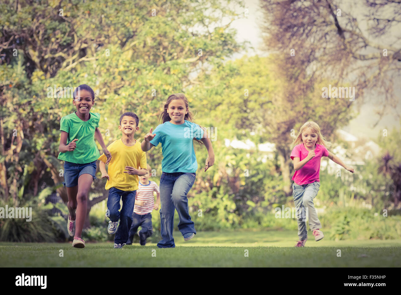 Boy running around grass hi-res stock photography and images - Alamy