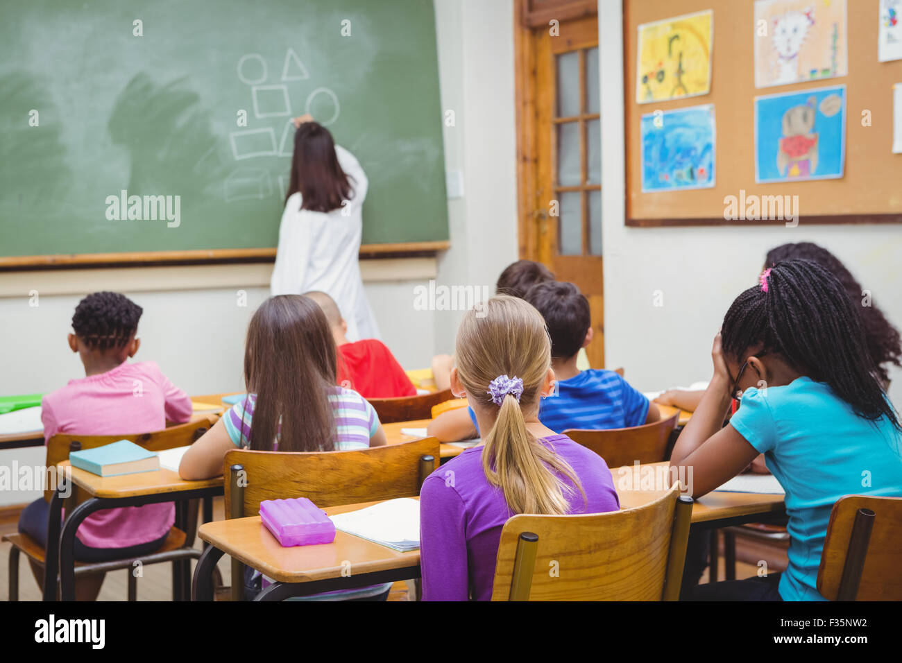 Students paying attention to the teacher Stock Photo - Alamy