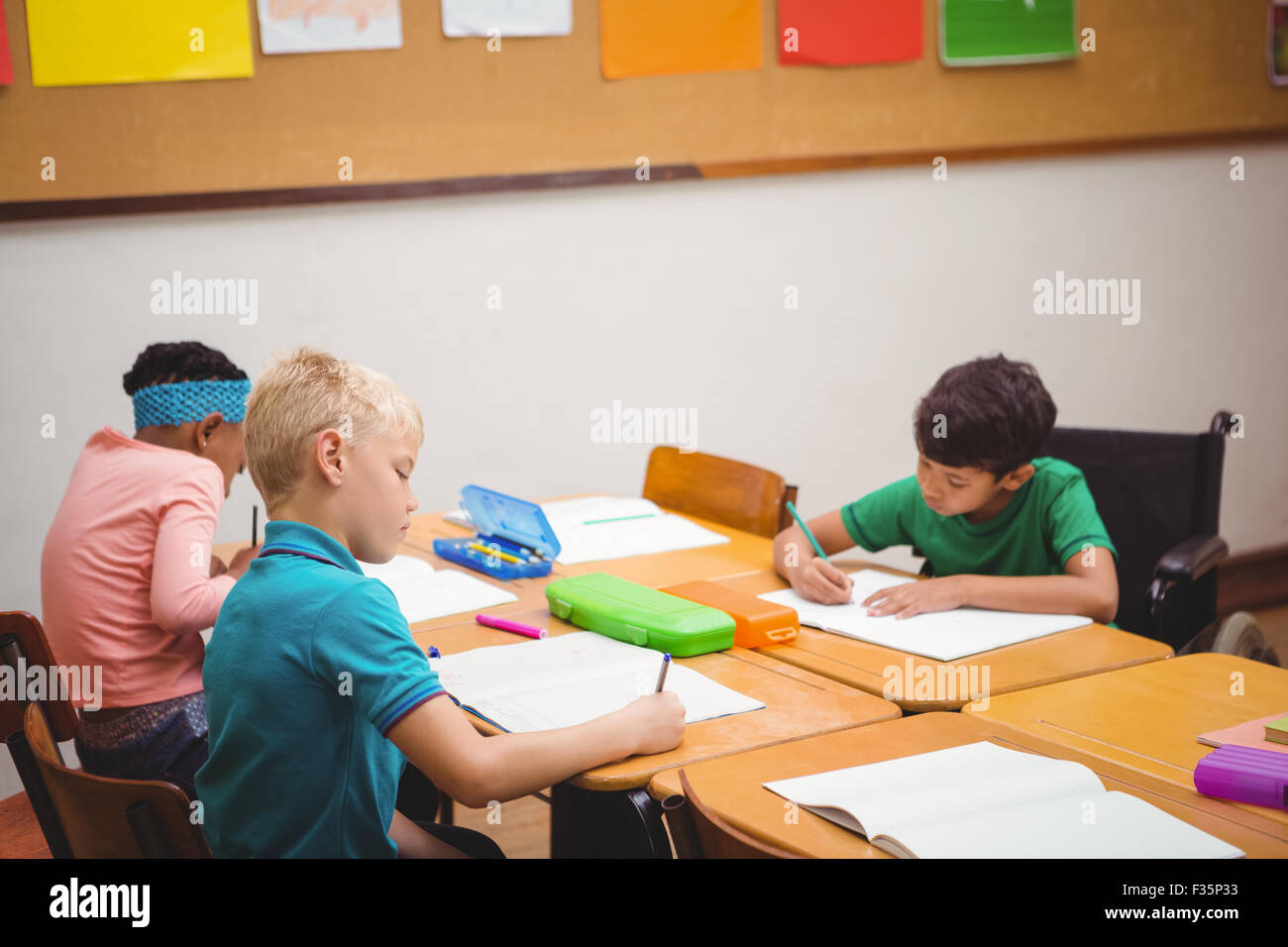 Busy students working on class work Stock Photo - Alamy