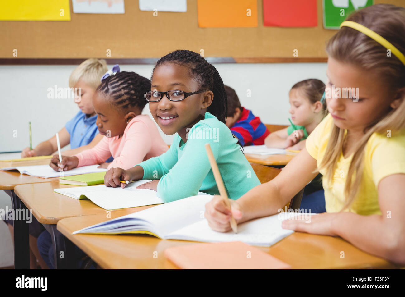 Pupil smiling at the camera Stock Photo - Alamy